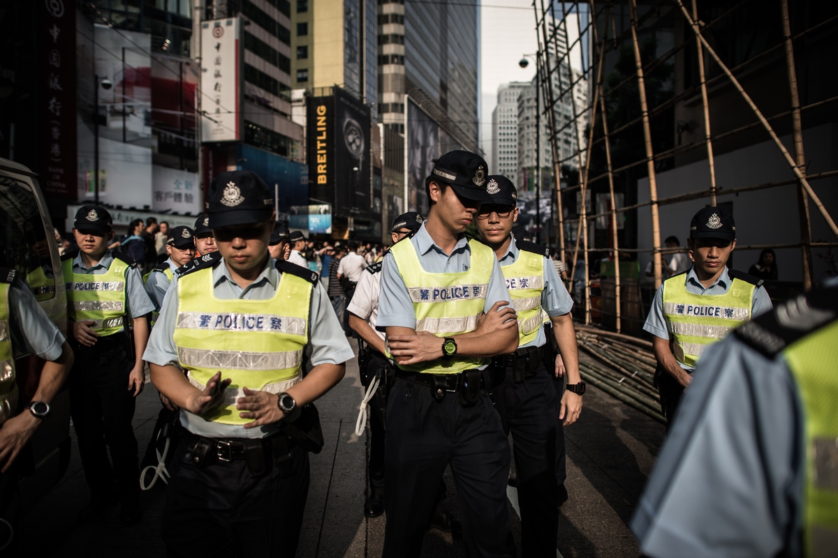 Hong Kong Police Officers Suspended After Allegedly Beating Pro